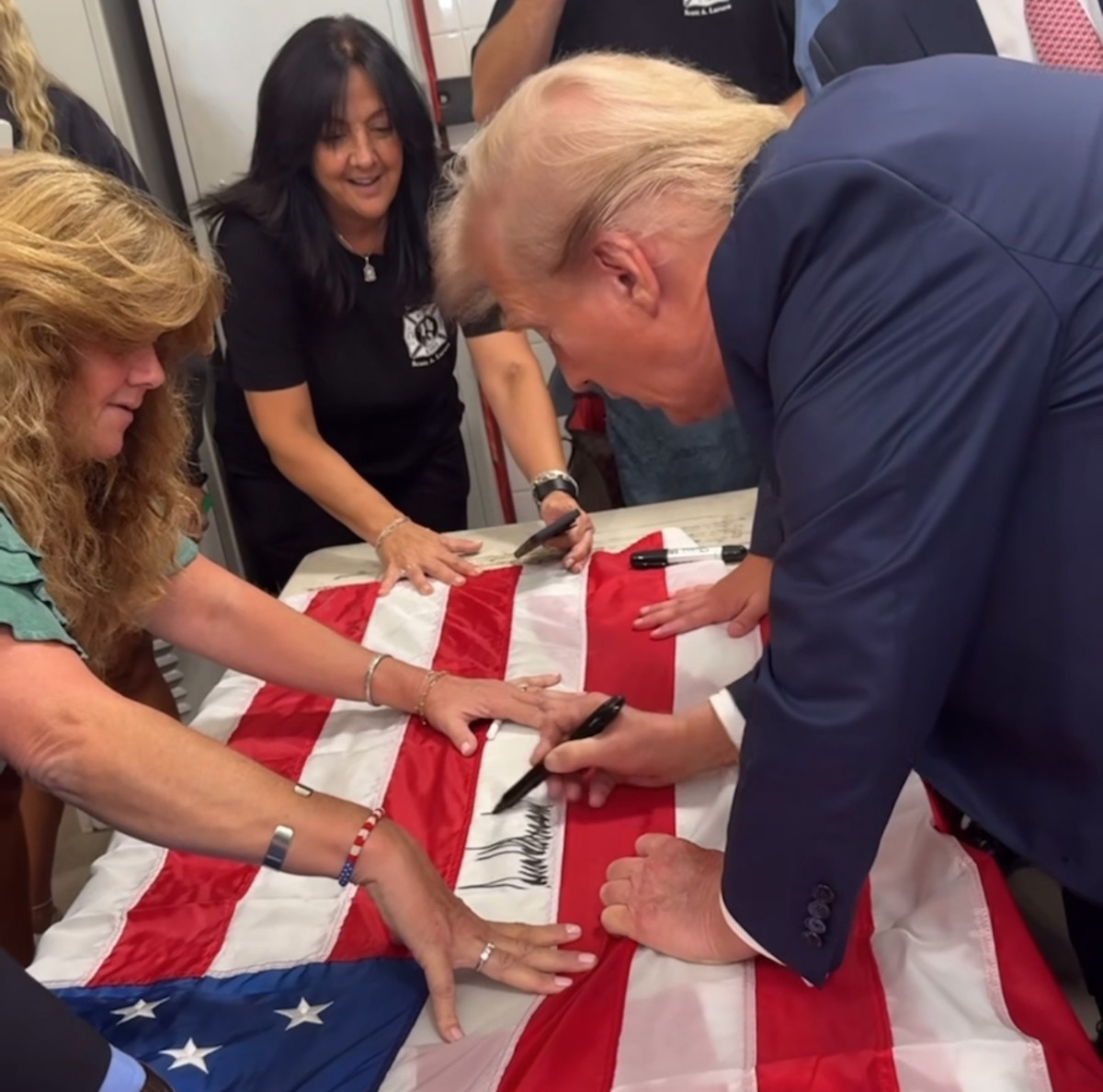 Viral Video: Trump Violated Flag Code, Signed American Flag on 9/11 ...